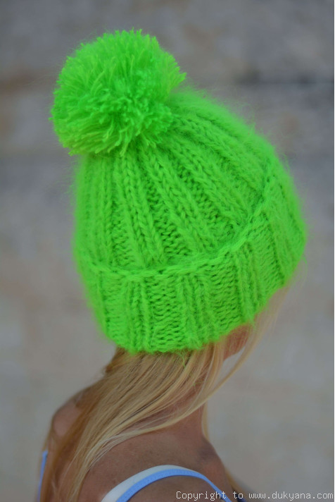 Warm winter ski hat with pompon knitted in neon green/HT14